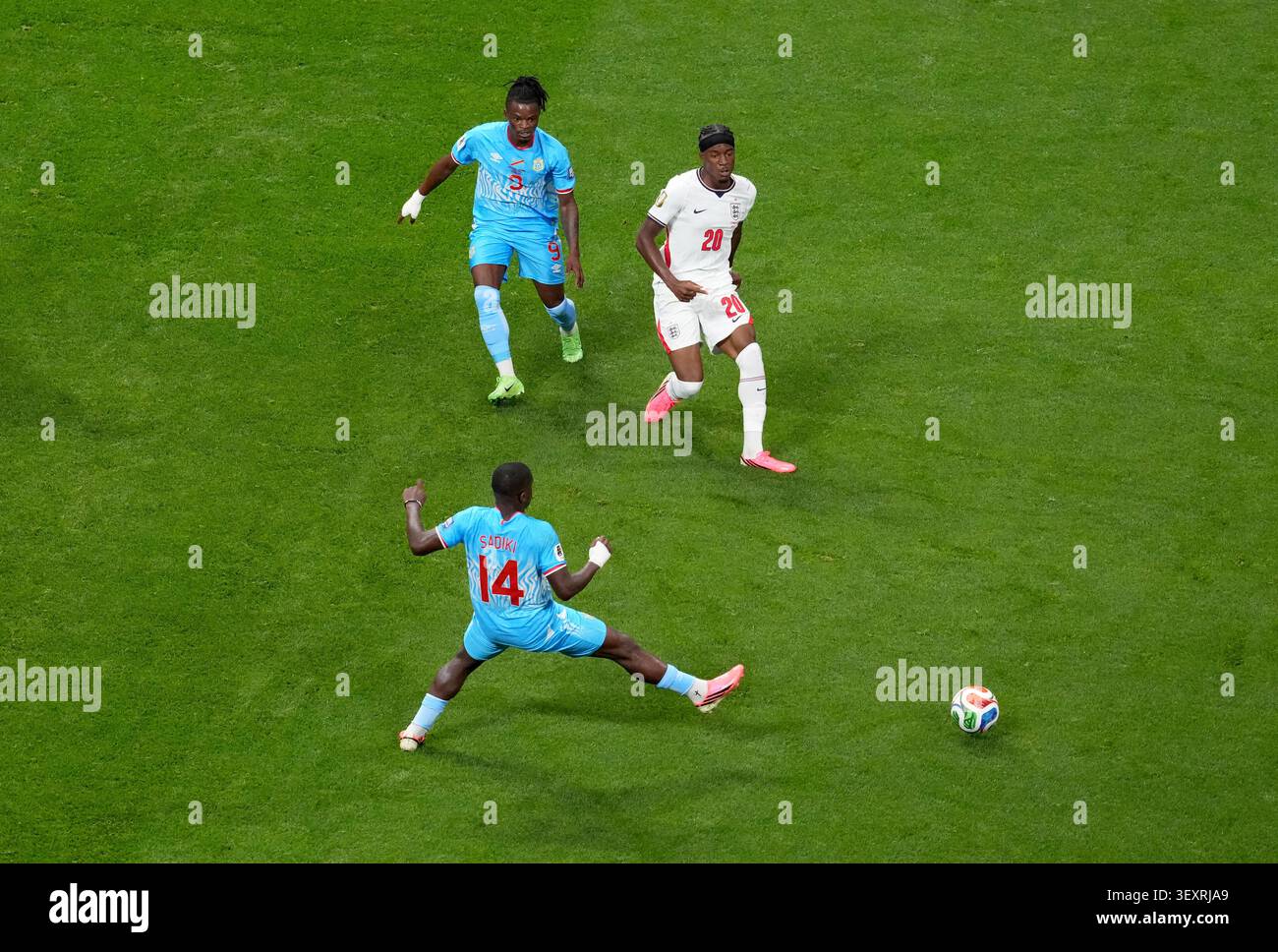England's Noni Madueke (right) battles for the ball with Congo DR's ...