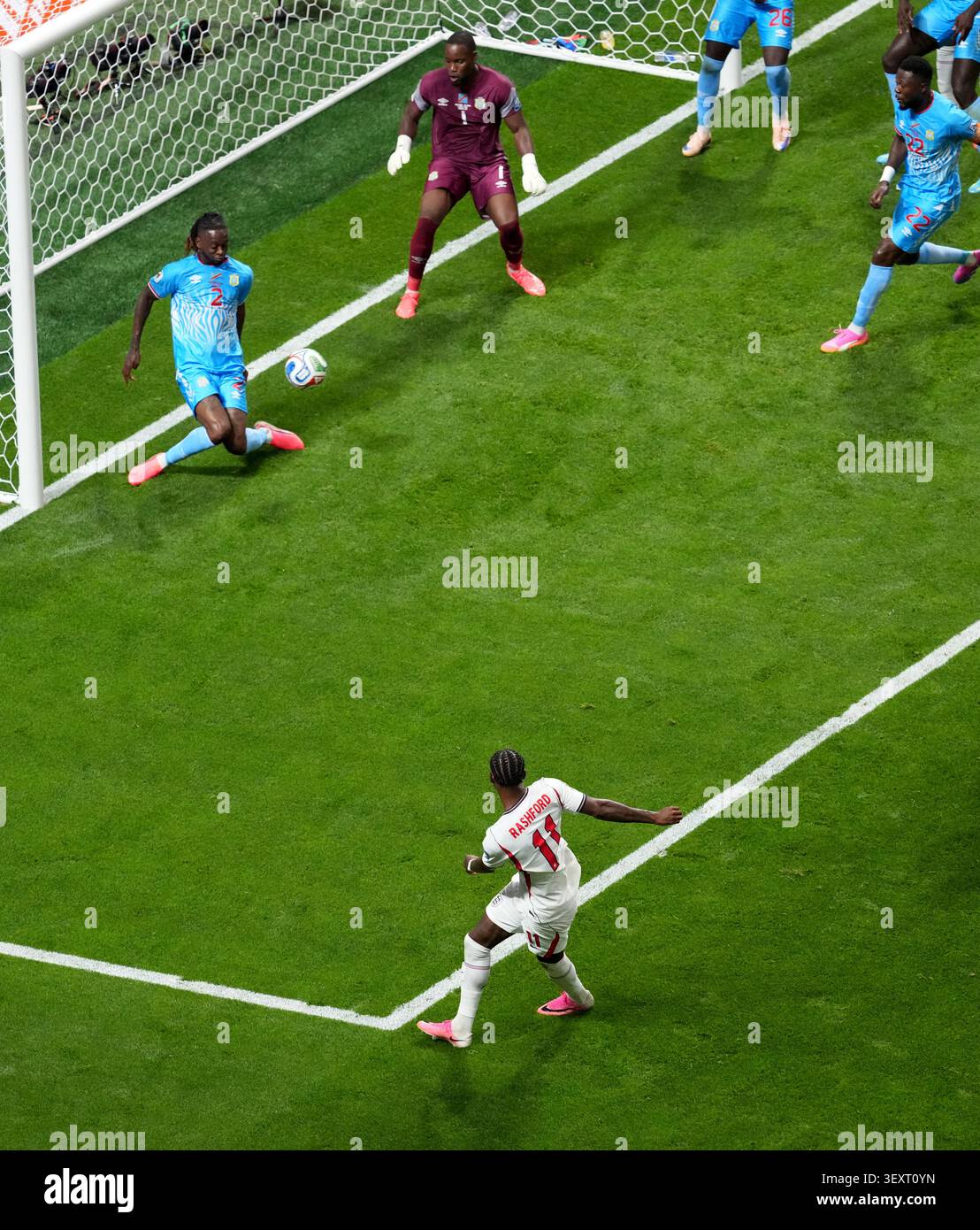 England's Marcus Rashford (bottom) sees his shot at goal blocked on the ...