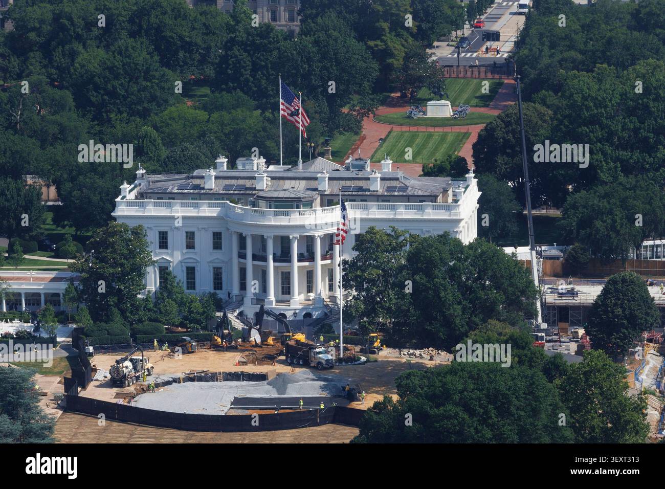 Construction workers continue designing a helipad for Marine One at the ...