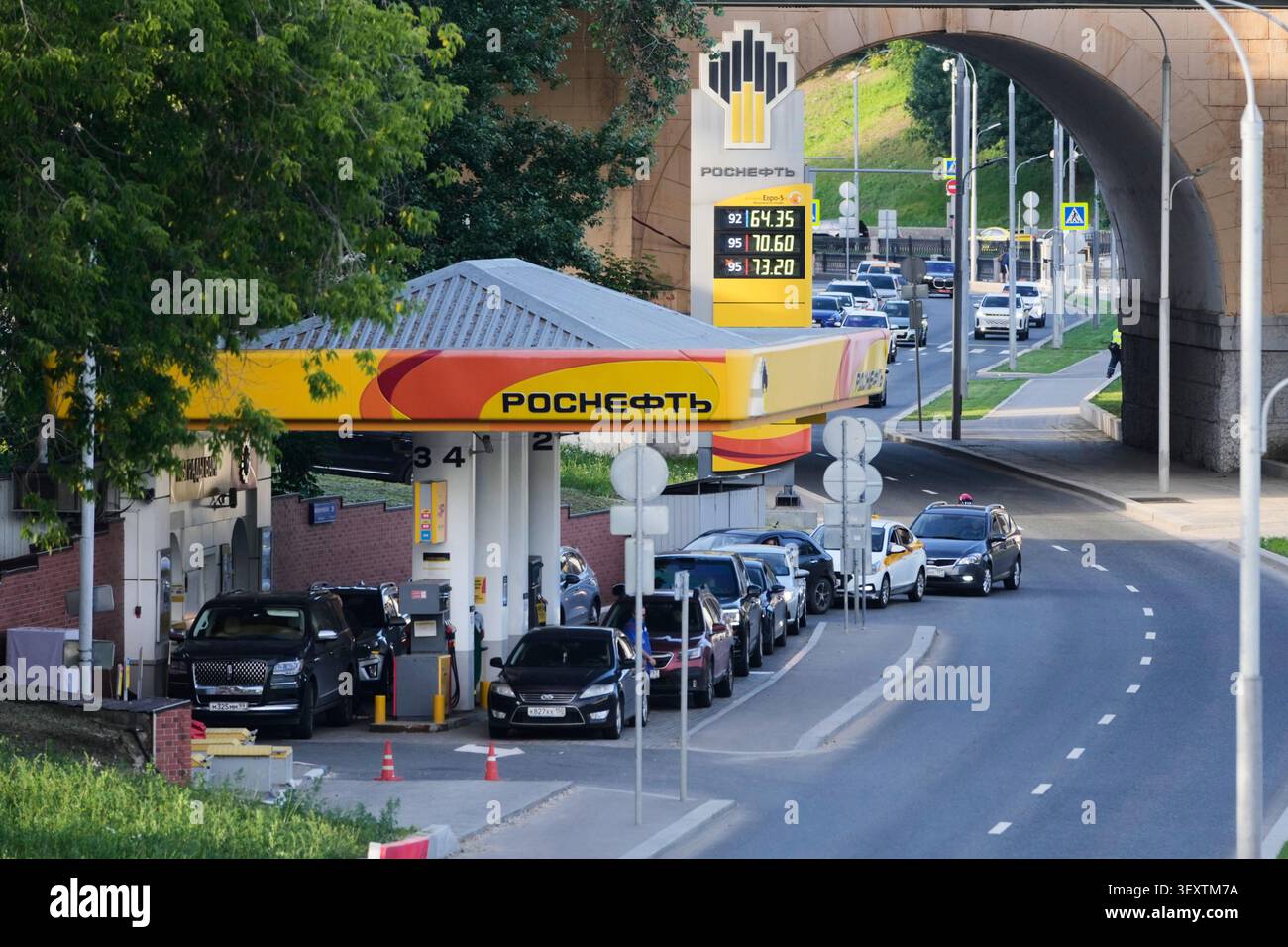 Vehicles line up at a Rosneft gas station in Moscow, on Monday, June 22 ...