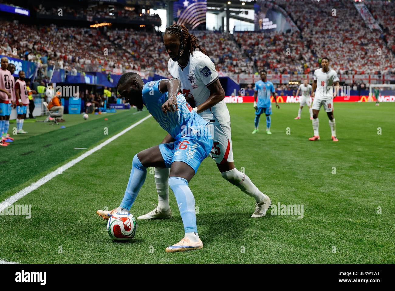 Congo's Arthur Masuaku (26) and England's Djed Spence battle for the ...