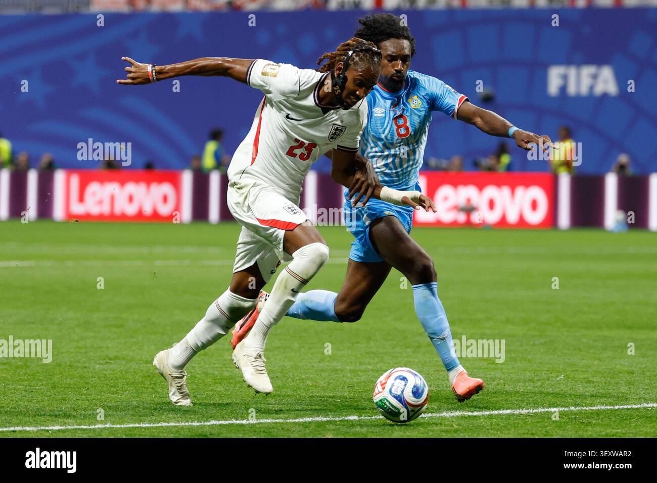 England's Djed Spence (25) and Congo's Samuel Moutoussamy battle for ...