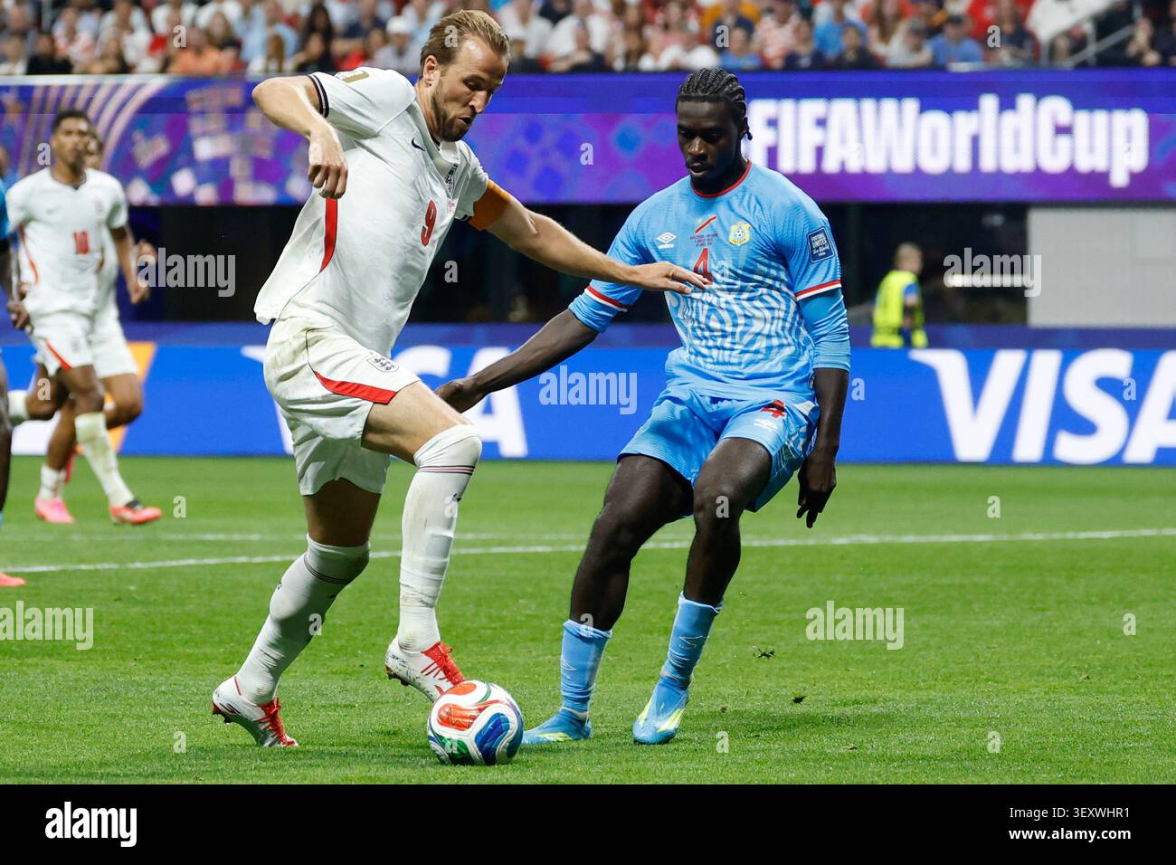 England's Harry Kane (9) and Congo's Axel Tuanzebe battle for the ball ...
