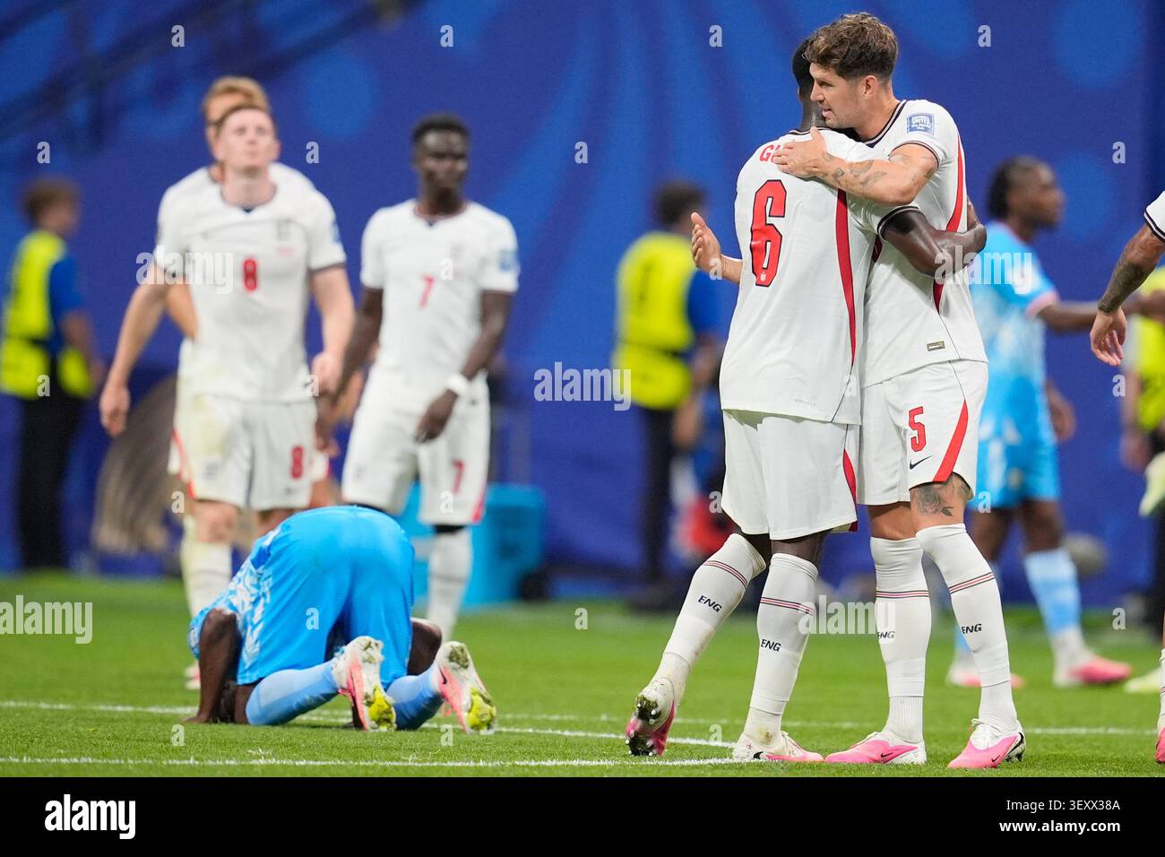 England's John Stones (5) embraces Marc Guehi after England's victory ...