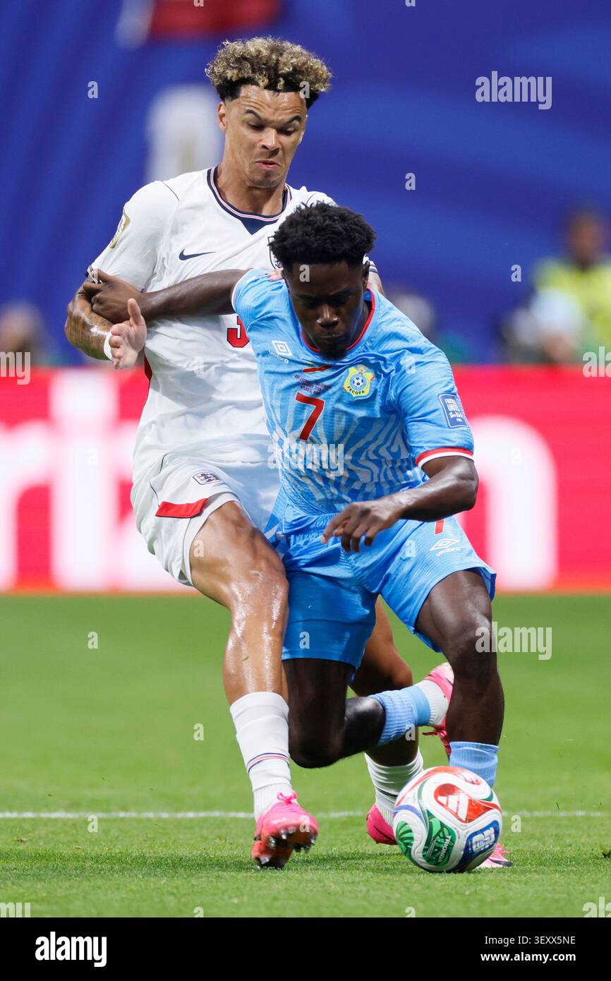 Nico O'Reilly of England and Nathanael Mbuku of Congo DR challenge ...