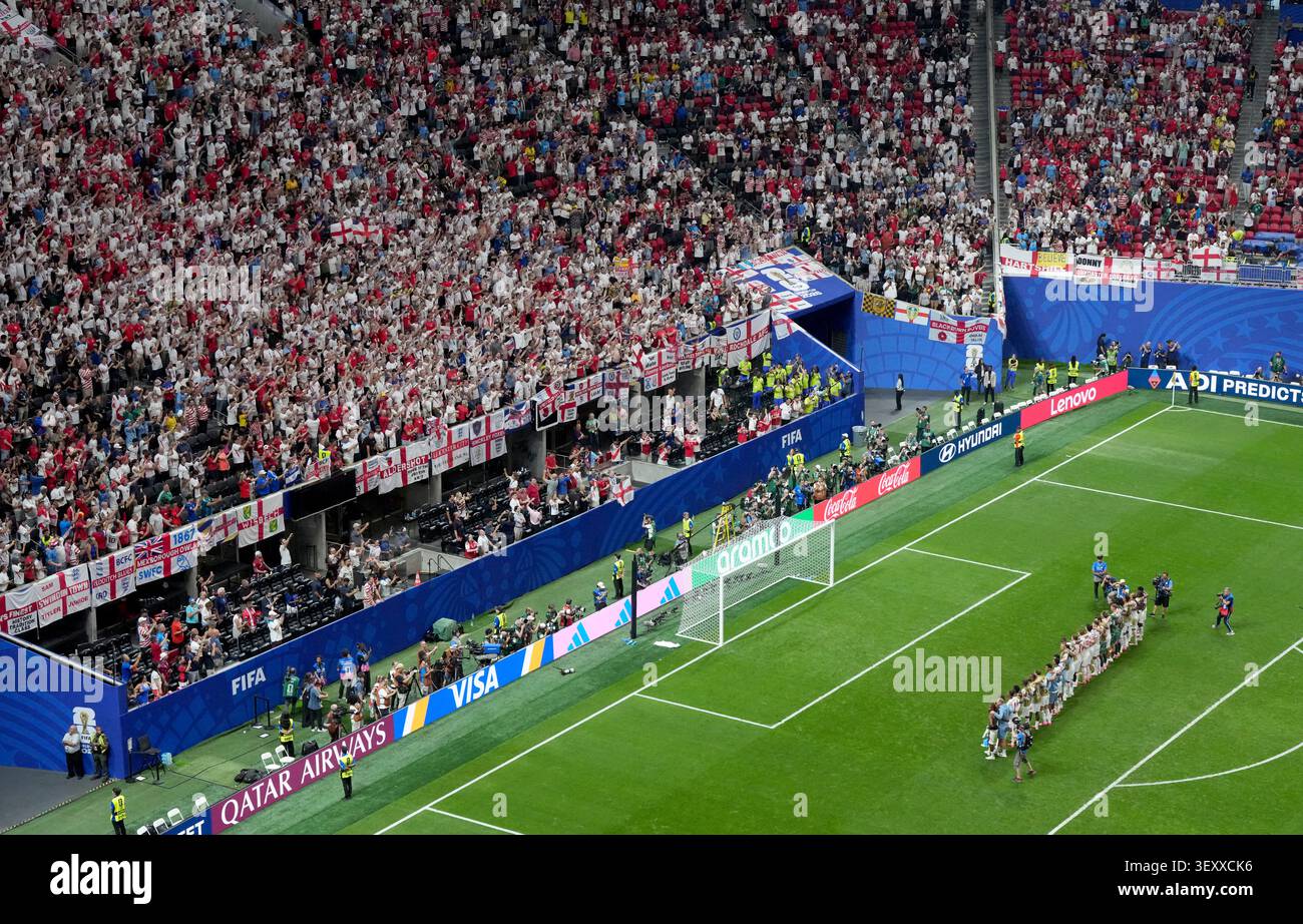 England's players stand in front of their fans as they celebrate after ...