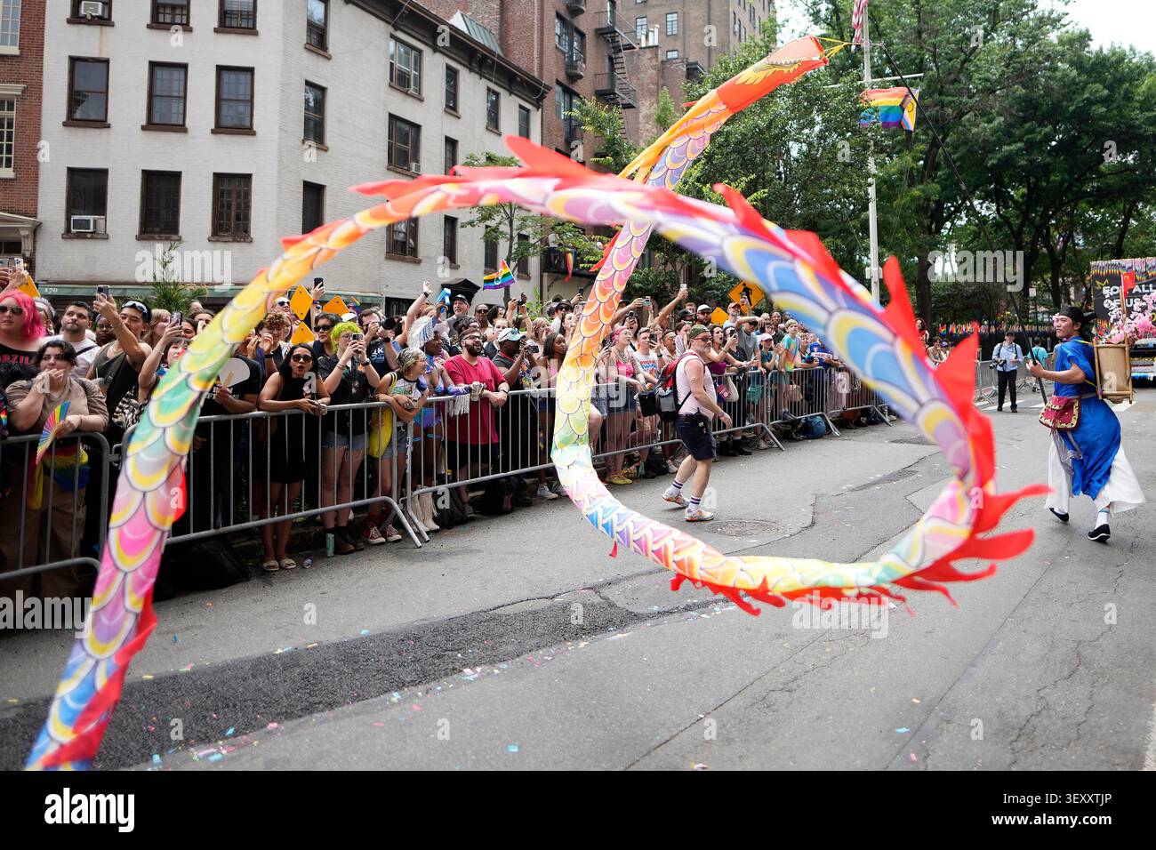 A parade-goer from the Chinese Rainbow Network with a Chinese dragon ...