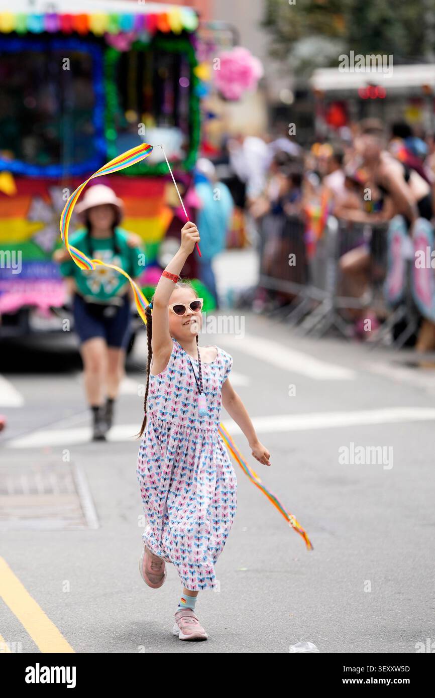 A young girl walks in the 57th annual NYC Pride March on Sunday, June ...