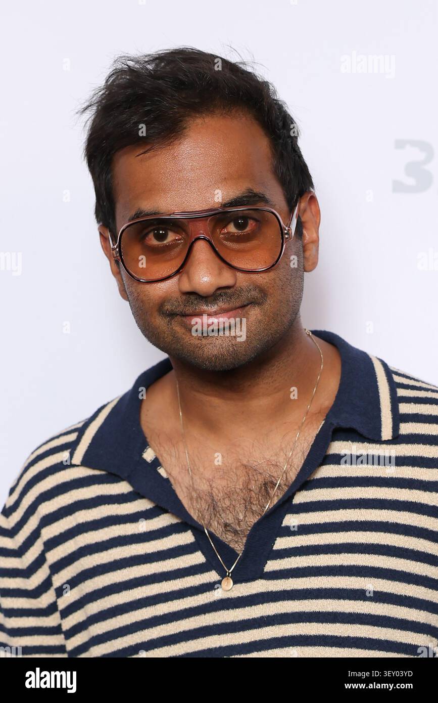 Aziz Ansari poses for photographers upon arrival at the premiere of the ...