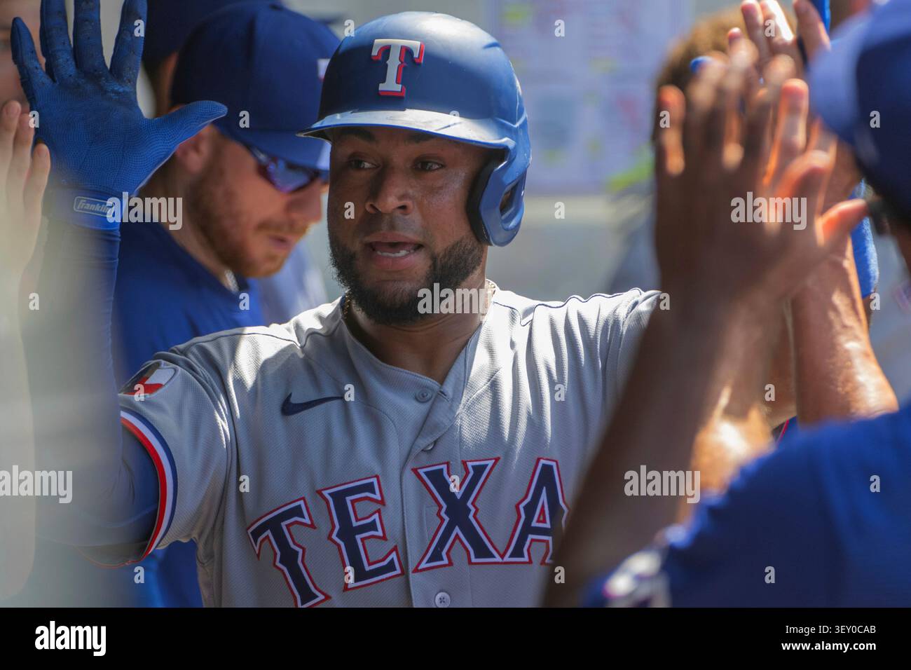 Texas Rangers' Elias Diaz is greeted by his teammates after hitting a ...