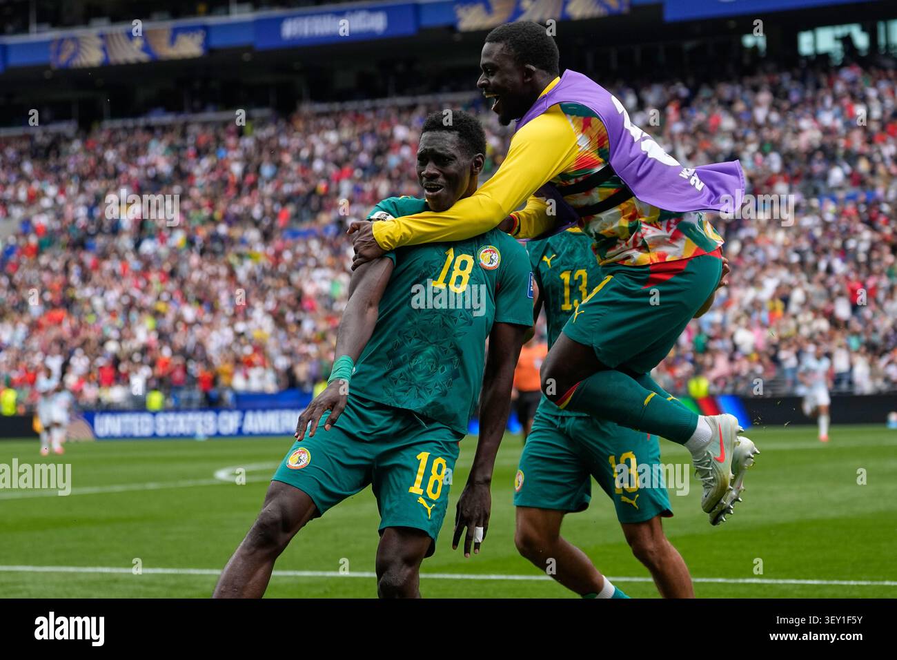 Senegal's Ismaila Sarr (18) is congratulated after scoring his side's ...