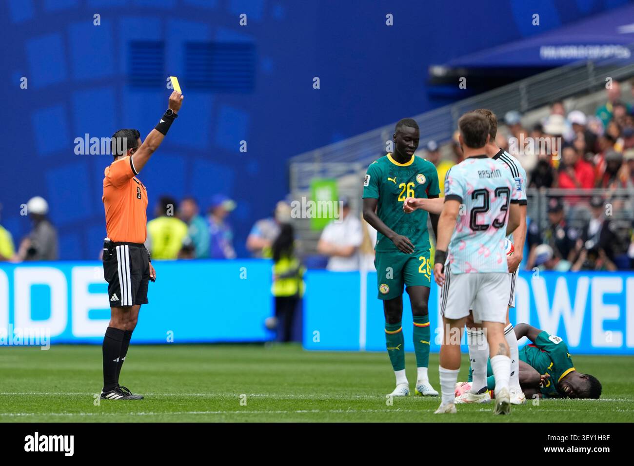Referee Said Martinez, of Honduras, shows a yellow card to Belgium's ...