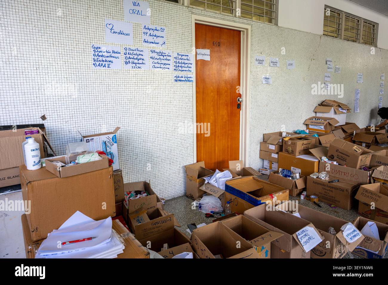 Volunteers organize medicines and medical supplies at the Collection ...