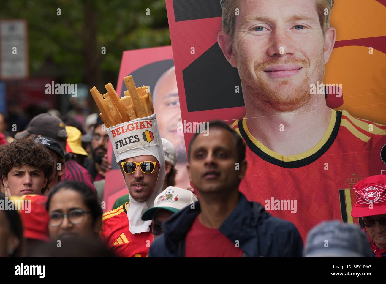 Seattle, WA, USA. 1 Jul, 2026. A Belgium fan wears a hat in front of a ...