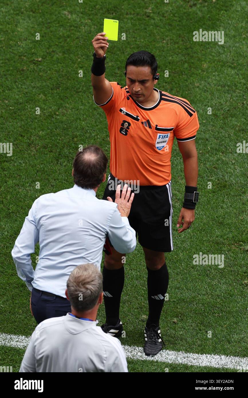 Referee Said Martinez, of Honduras, shows the yellow card to Belgium ...