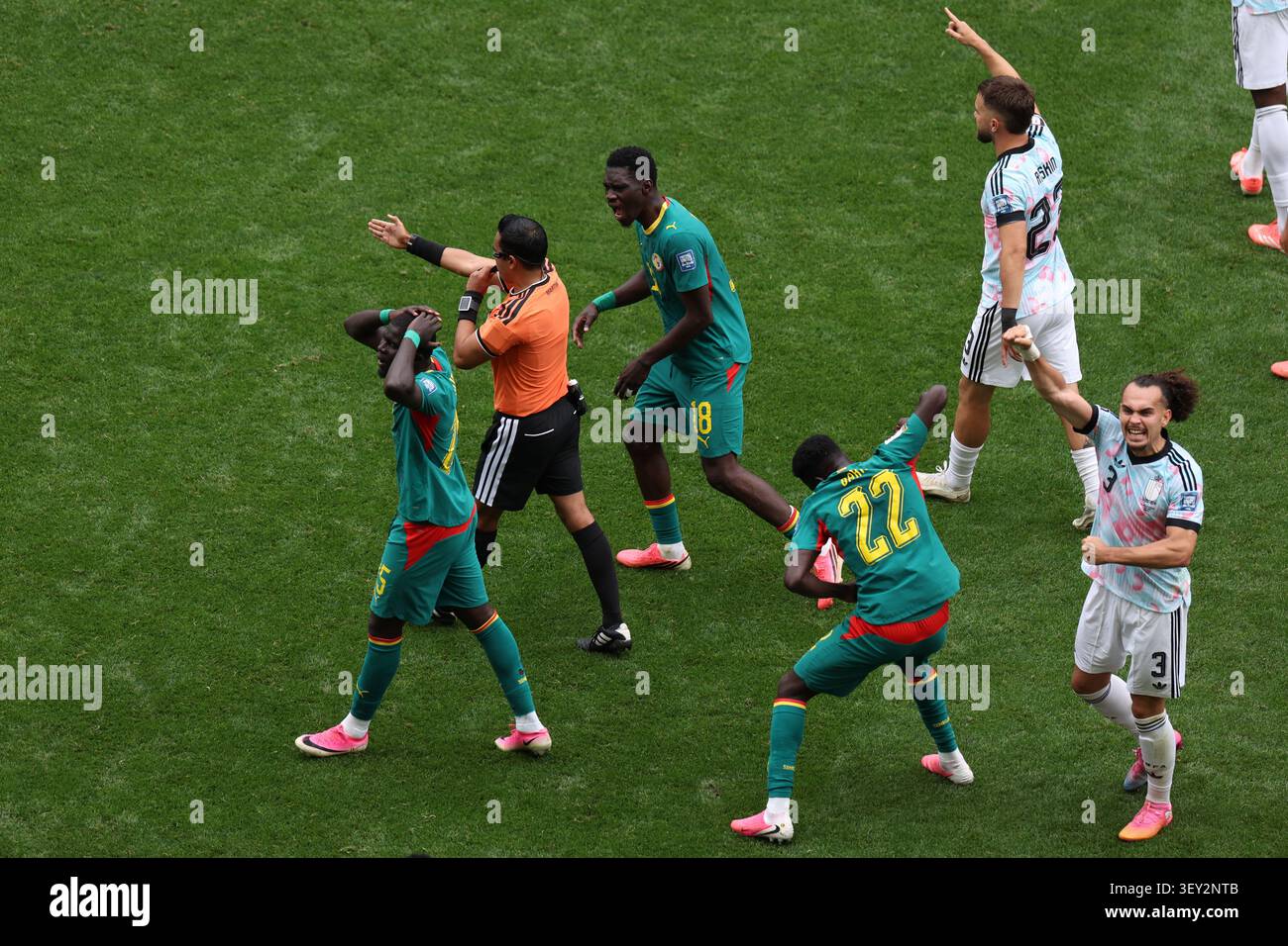 Referee Said Martinez, of Honduras, points to the penalty spot after a ...