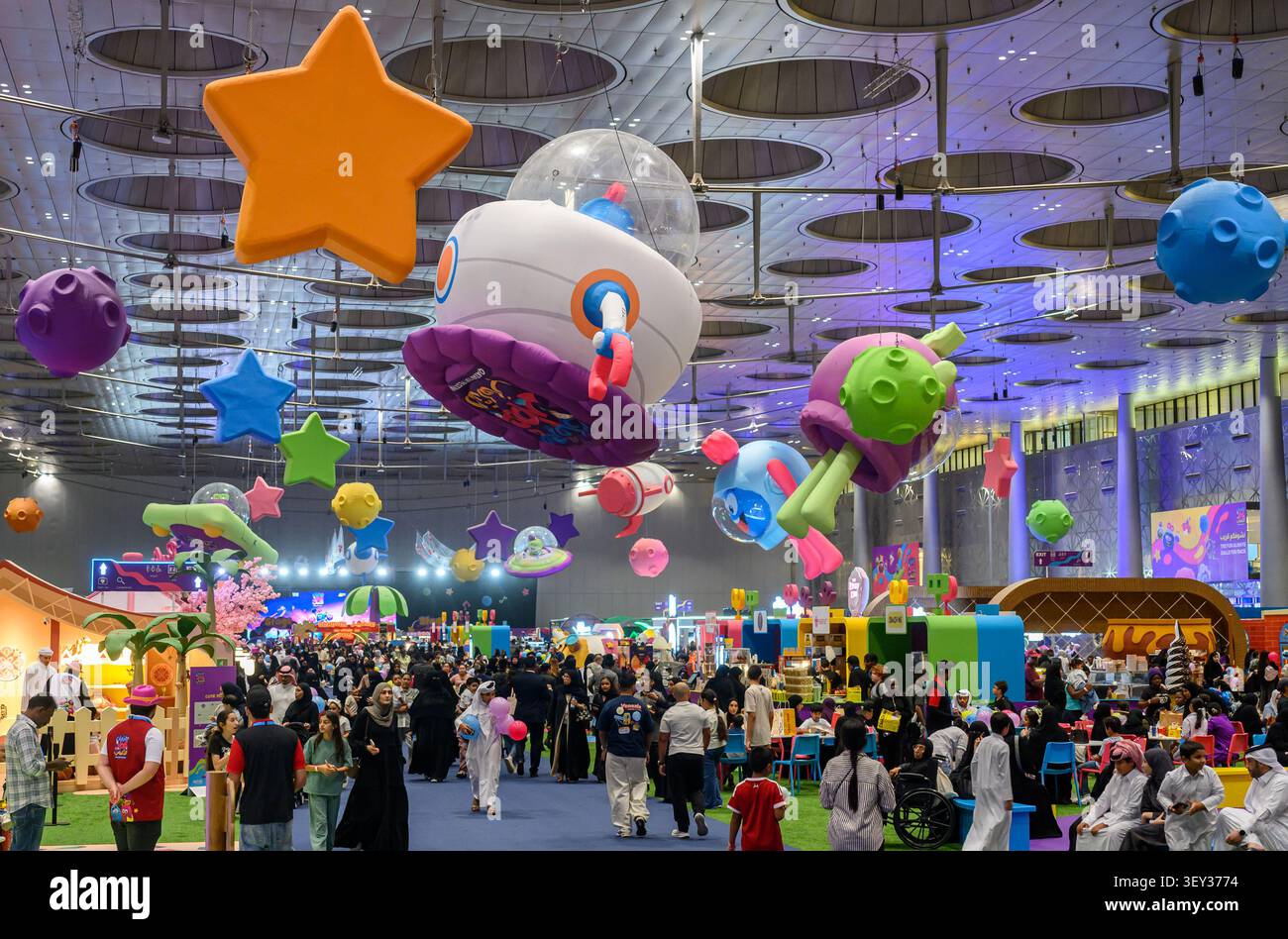 People visit the Qatar Toy Festival opening day at Doha Exhibition and ...