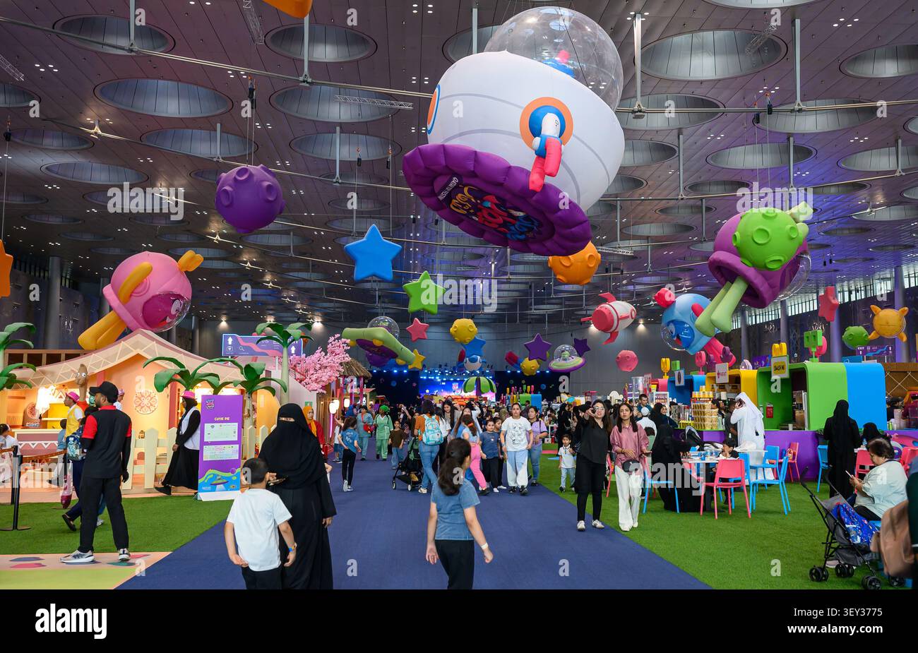 People visit the Qatar Toy Festival opening day at Doha Exhibition and ...