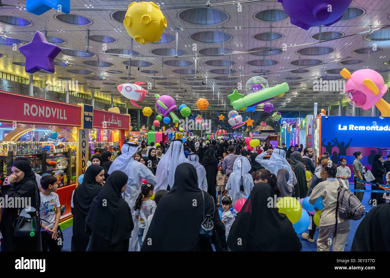 People visit the Qatar Toy Festival opening day at Doha Exhibition and ...