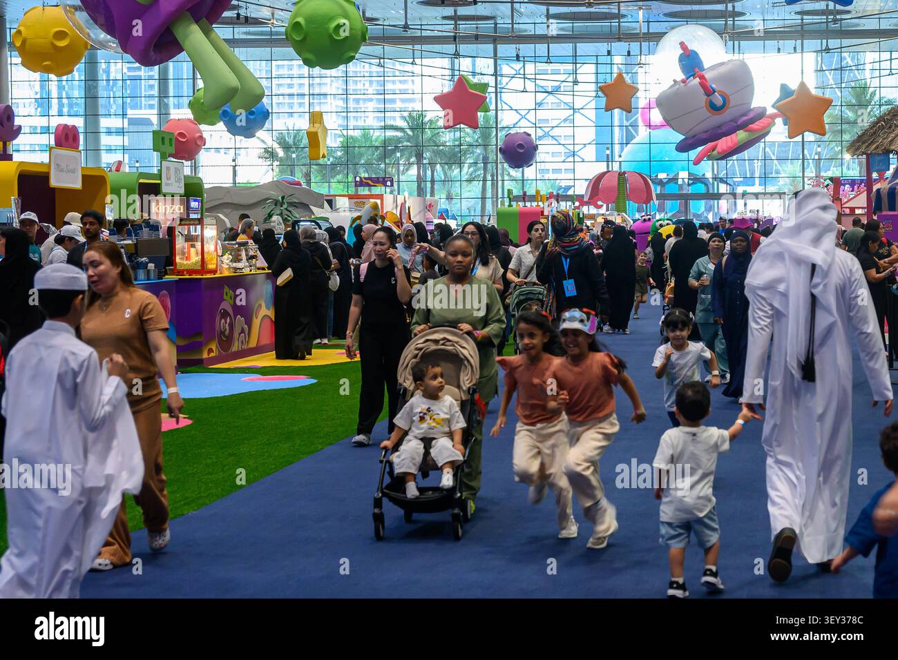 People visit the Qatar Toy Festival opening day at Doha Exhibition and ...