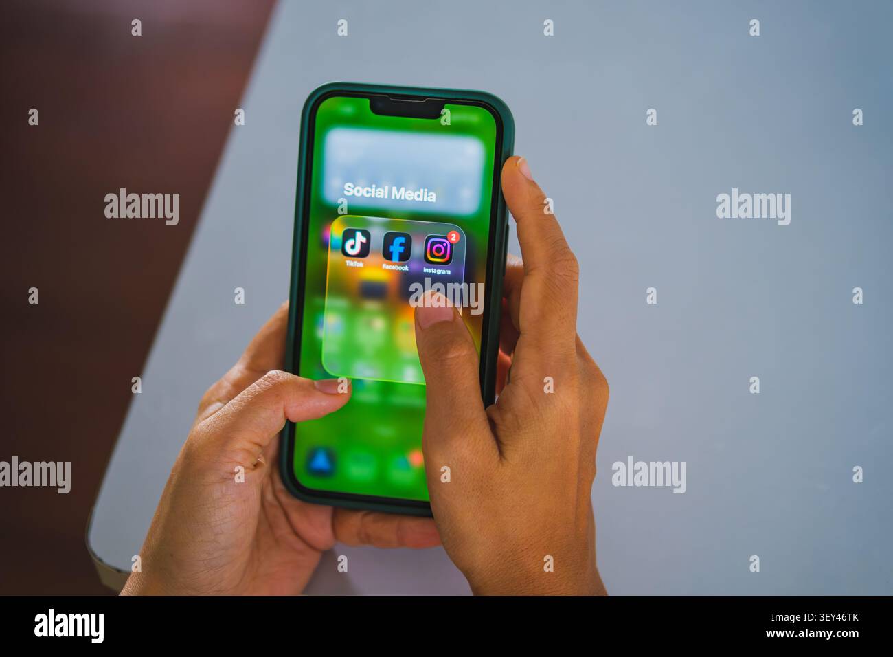 Balikpapan, Indonesia - May 31 2026. A vertical close-up shot of hands ...