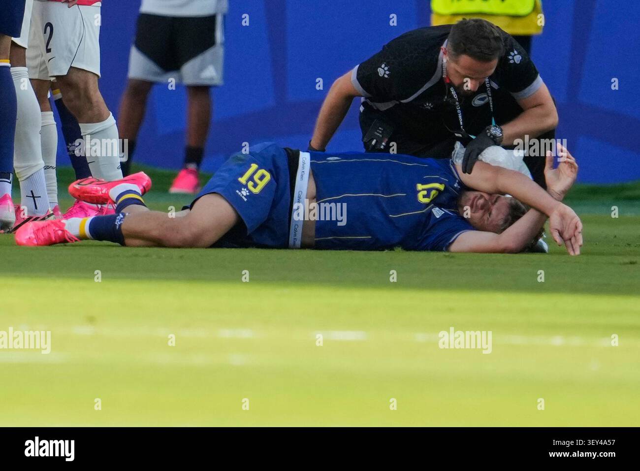Bosnia's Kerim Alajbegovic receives medical attention during the World ...