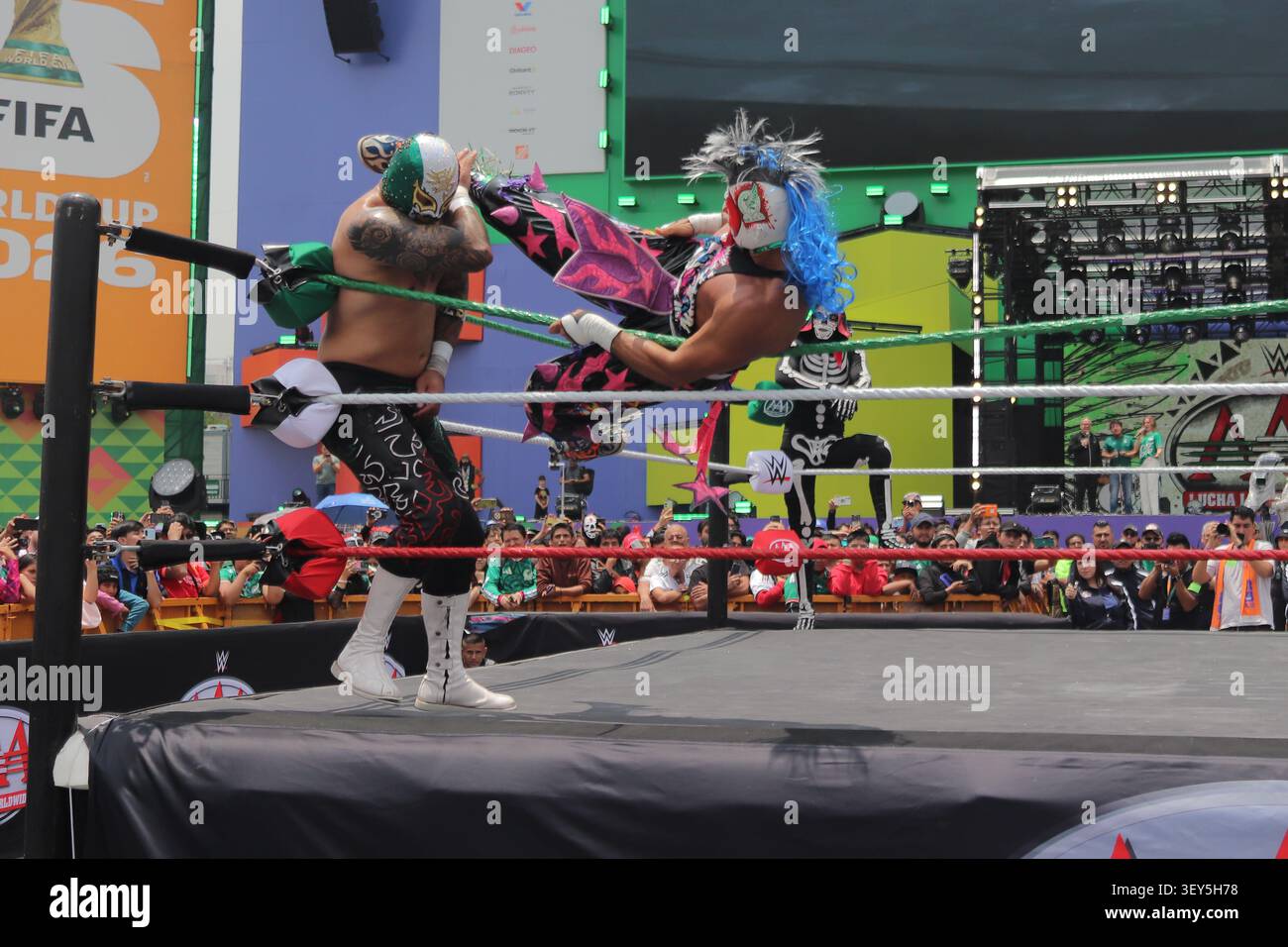 Wrestler Psyco Clown makes a flying calf kick against Forastero in a ...
