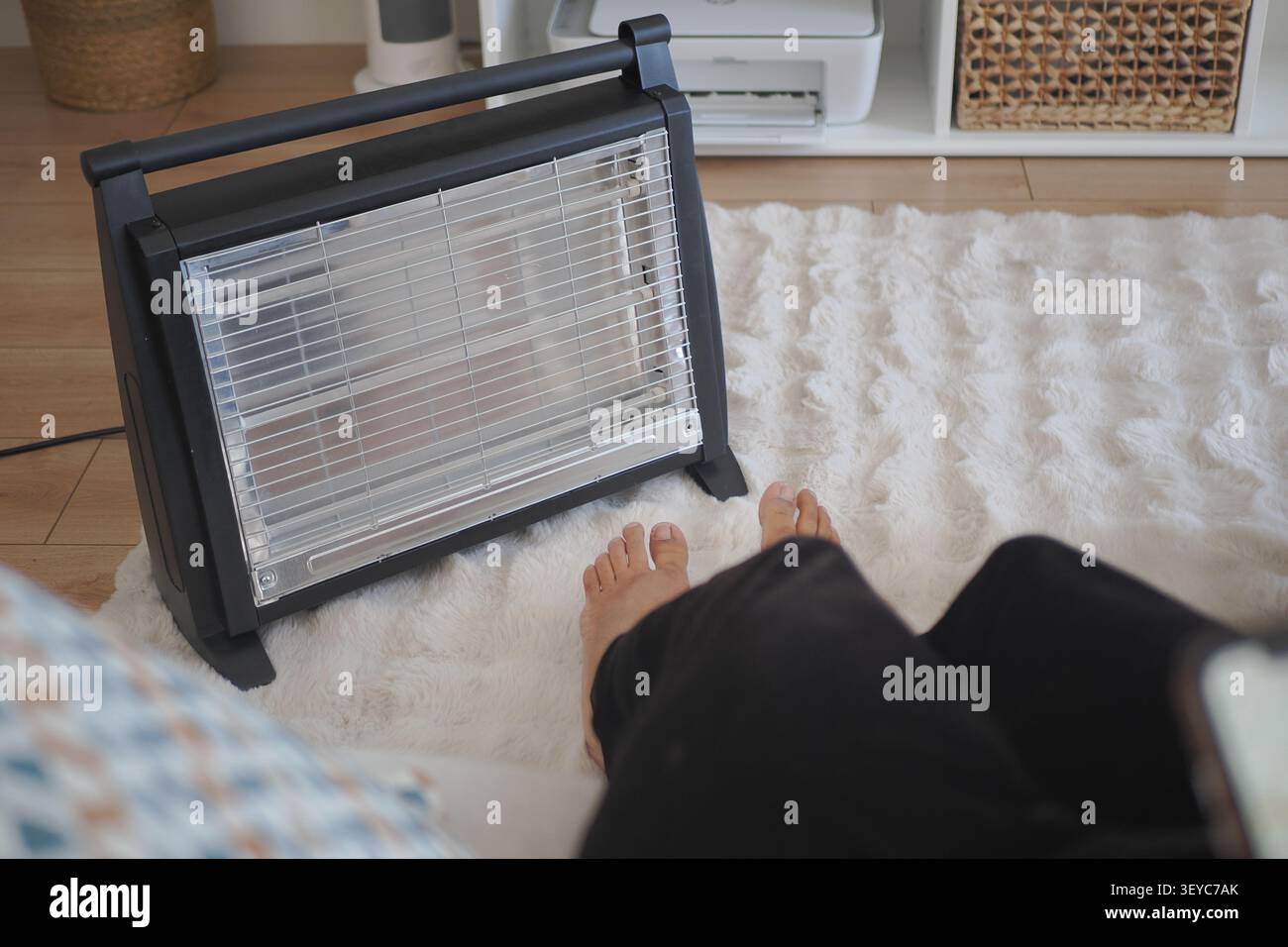 Warm feet near a heater on a winter day at home Stock Photo - Alamy