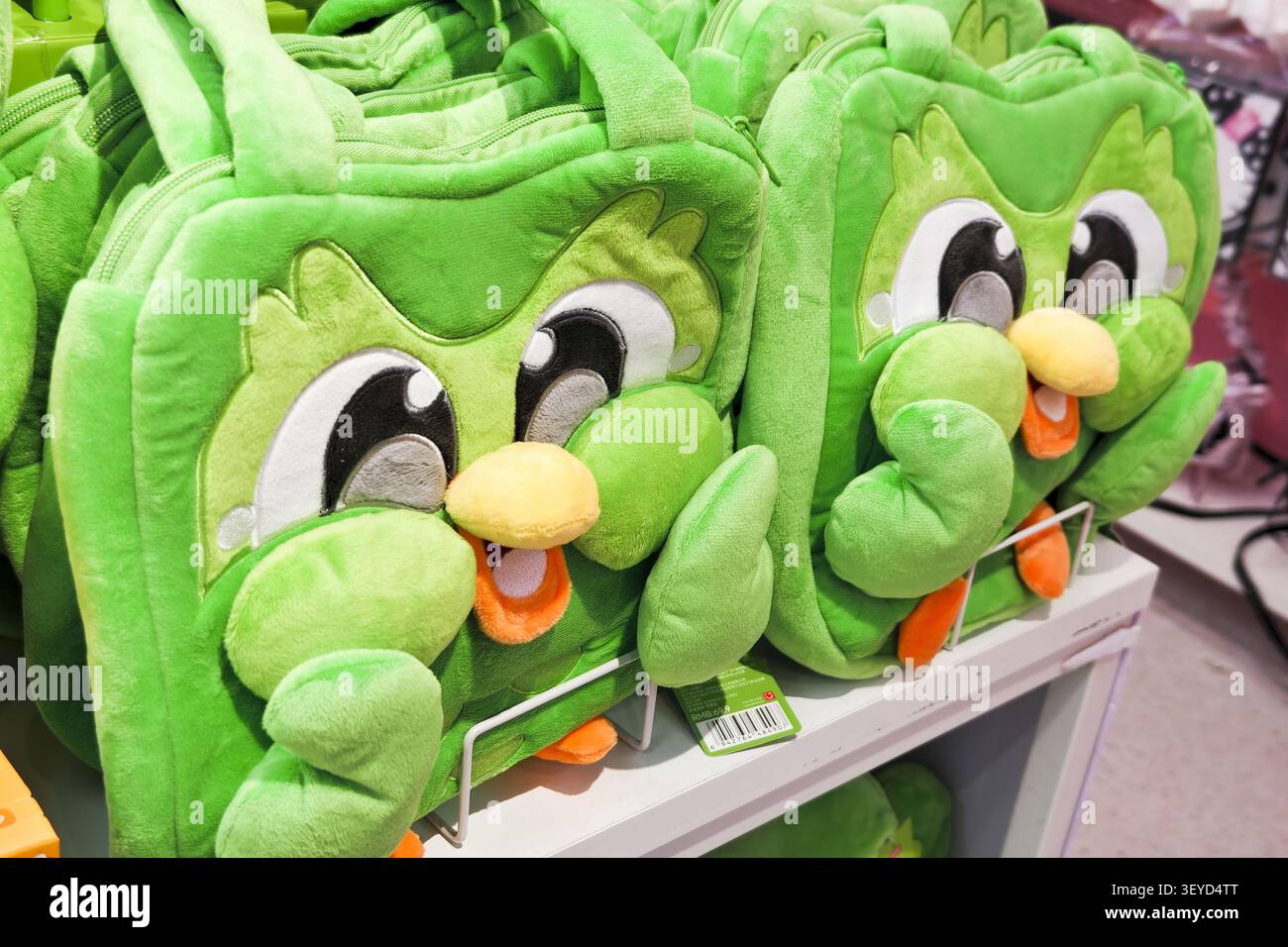 Duolingo-branded merchandise is displayed at a MINISO store in Shanghai ...