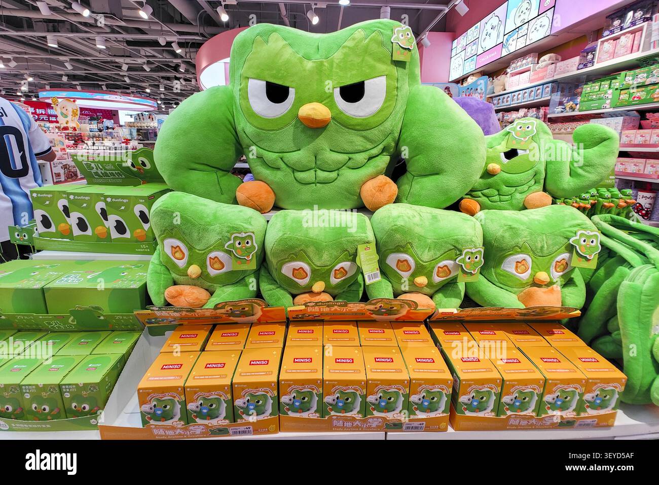 Duolingo-branded merchandise is displayed at a MINISO store in Shanghai ...