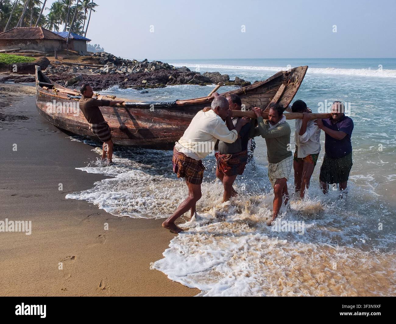 Group local fishermen pulling heavy hi-res stock photography and images ...