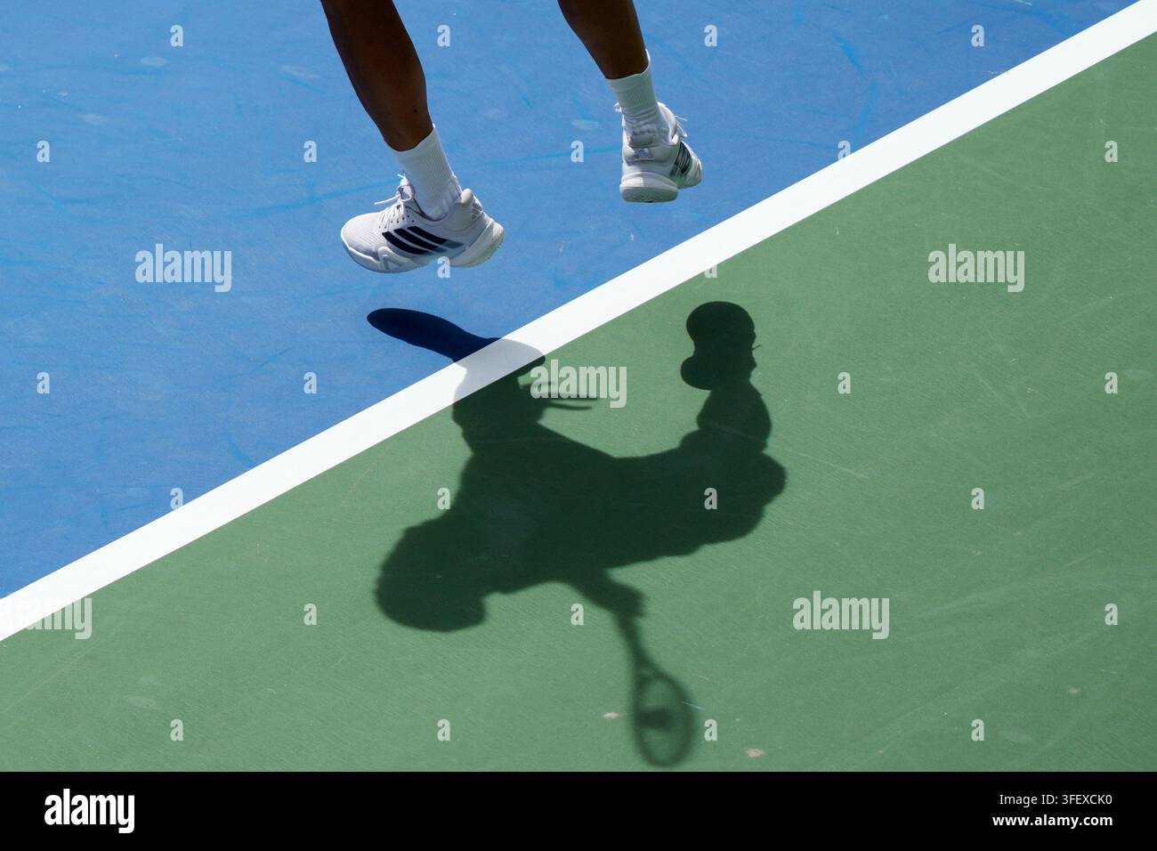 Francisco Cerundolo Of Argentina Serves The Ball To Taylor Fritz Of
