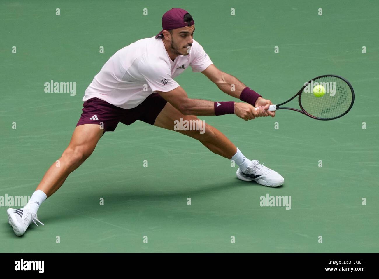 Francisco Cerundolo Of Argentina Returns The Ball To Taylor Fritz Of