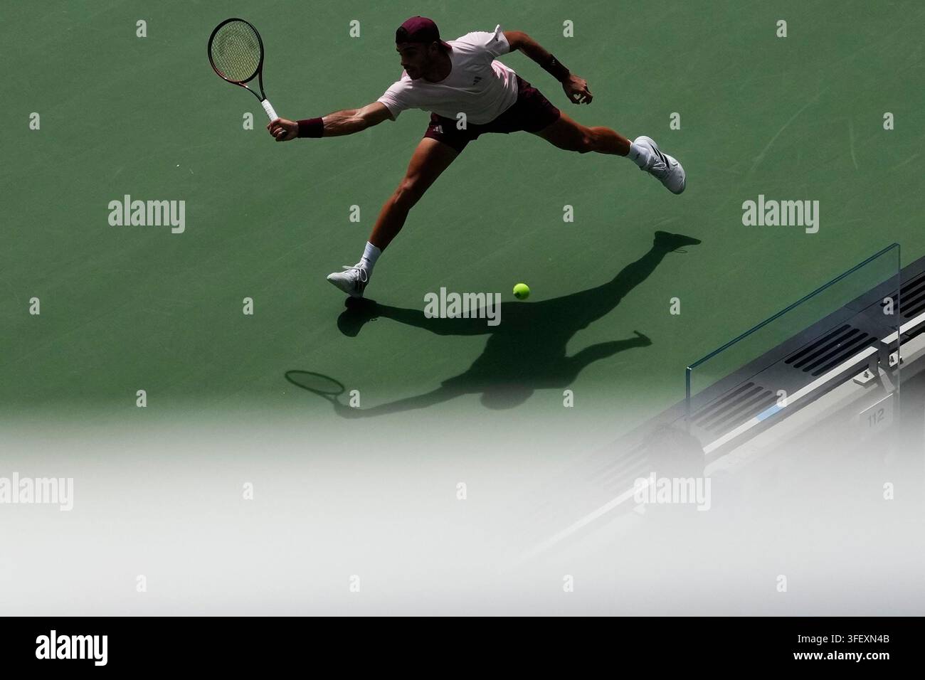 Francisco Cerundolo Of Argentina Returns The Ball To Taylor Fritz Of