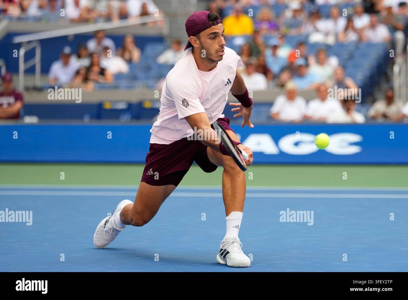 Francisco Cerundolo Of Argentina Returns The Ball To Taylor Fritz Of