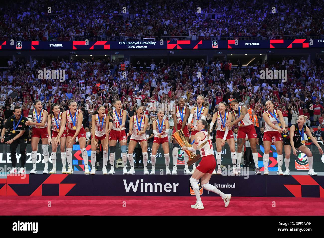 Turkey's Eda Erdem Dundar brings the trophy to the team after winning ...