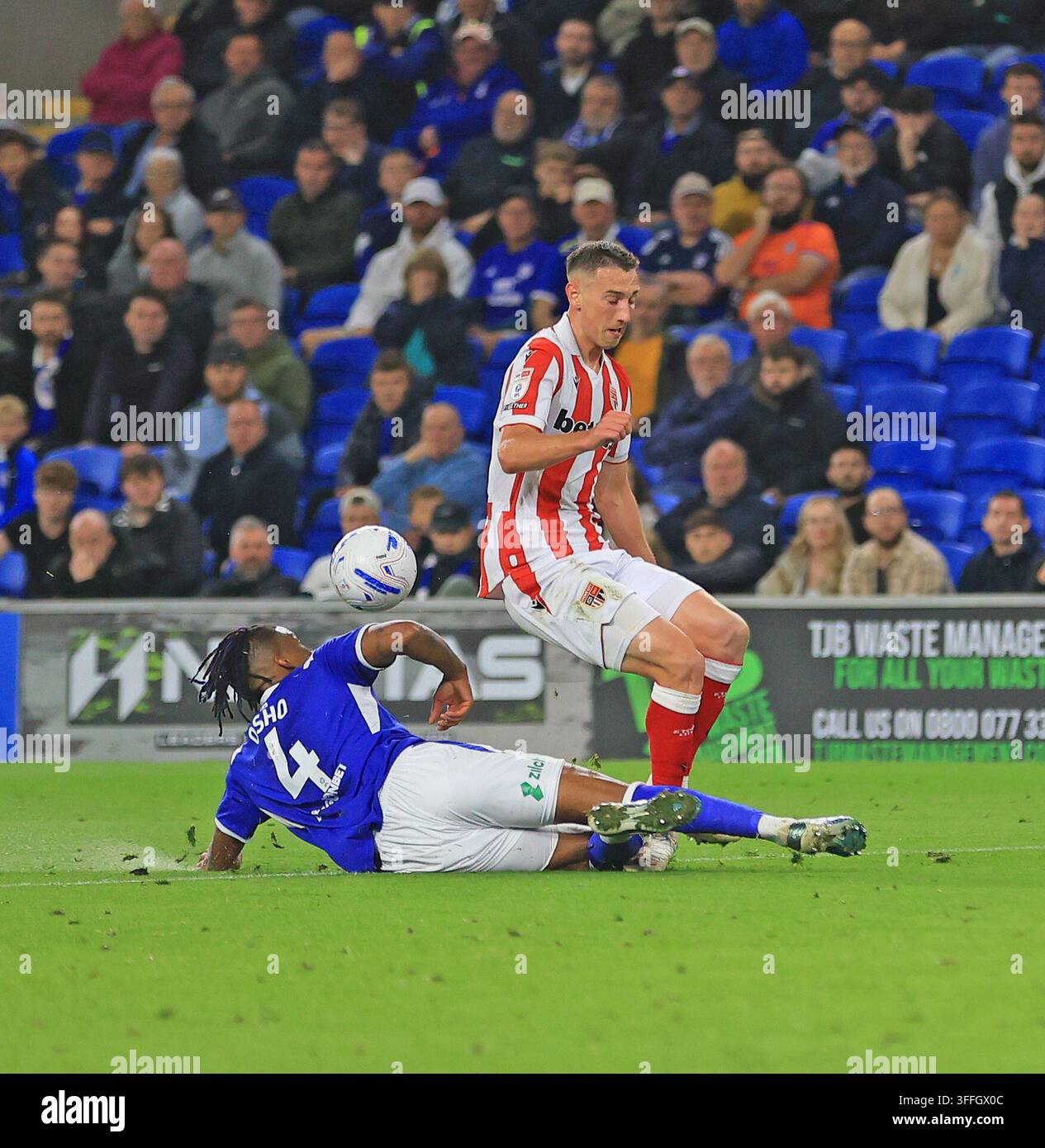 Cardiff City's Gabriel Osho tackles Stoke City's Róbert Boženík in the ...