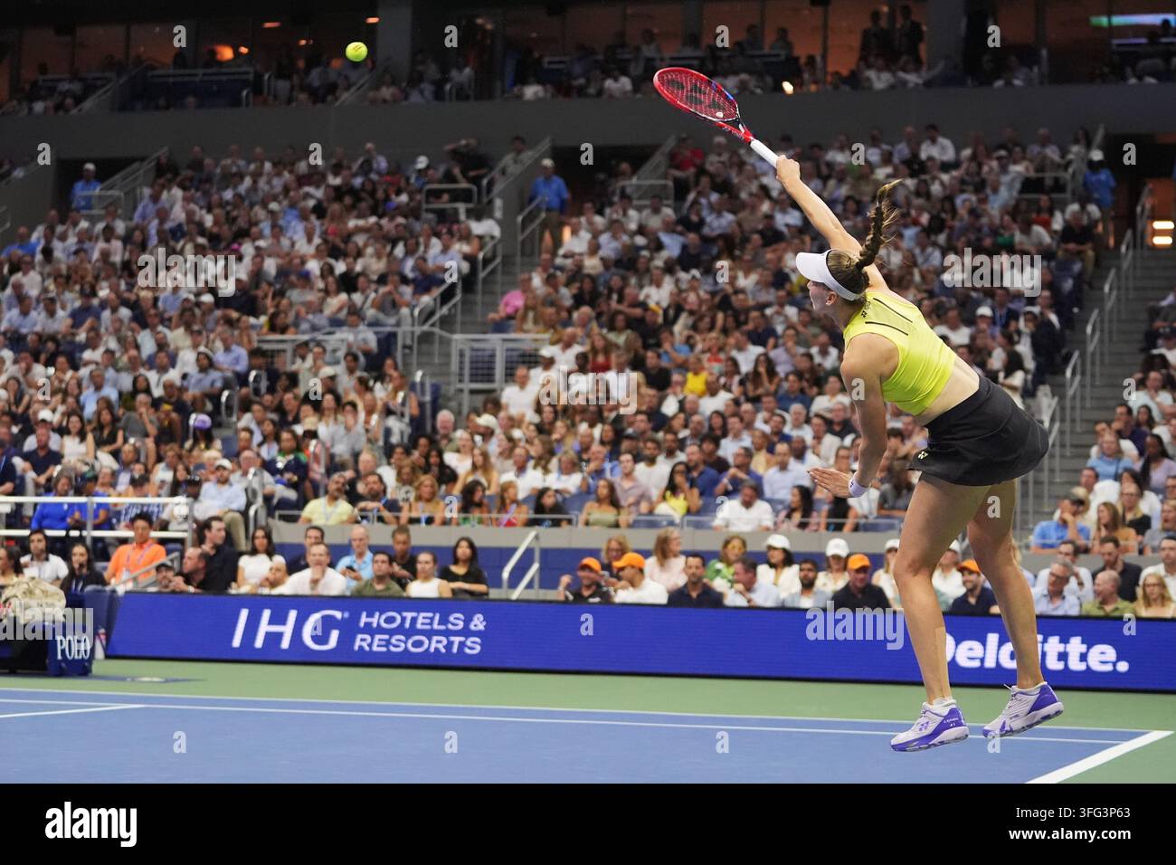 Elena Rybakina Of Kazakhstan Serves The Ball To Coco Gauff Of The