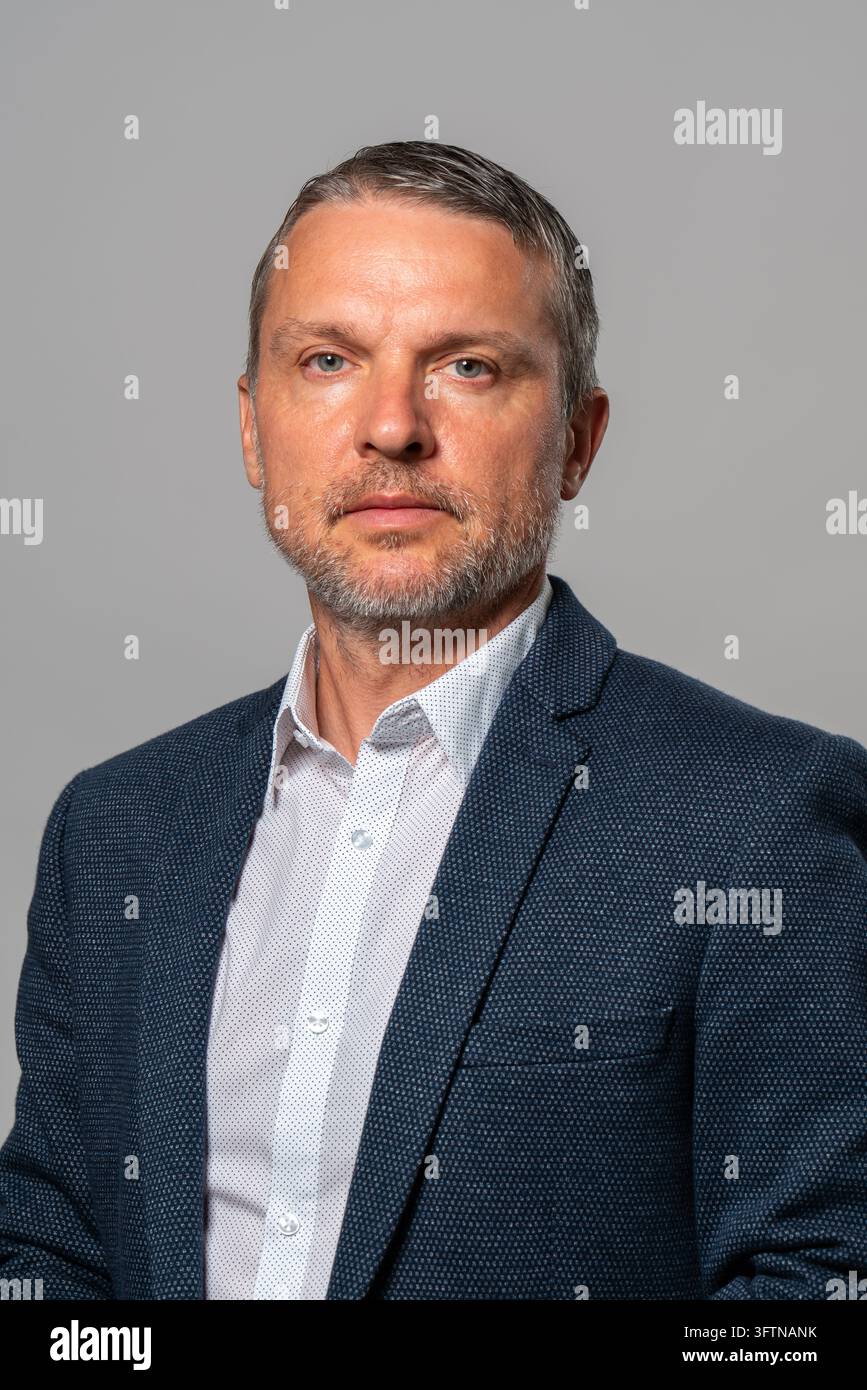 Close up portrait of stylish mature man with beard wearing an elegant ...