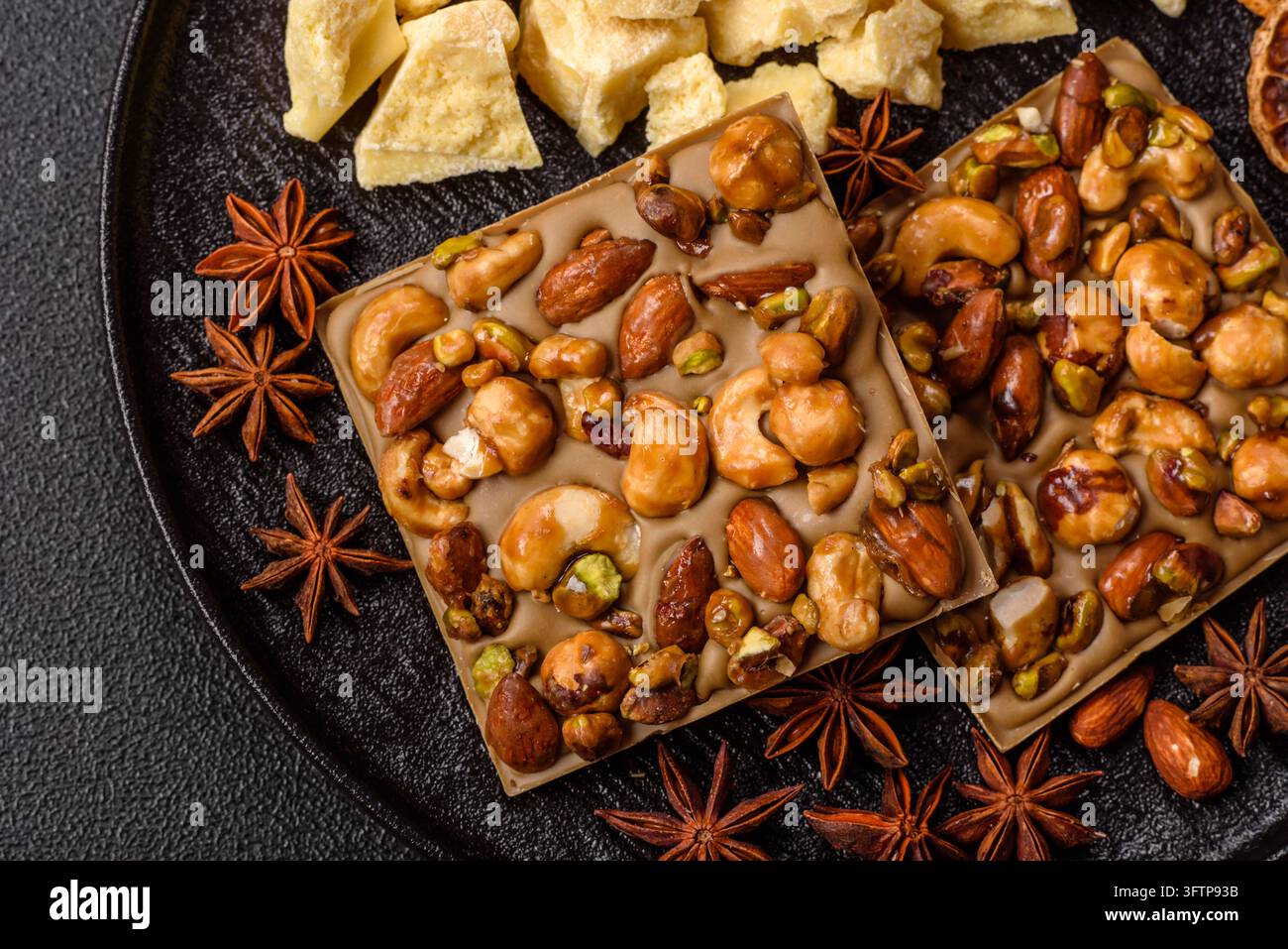 A bar of sugar free white chocolate with pistachios, almonds, and ...