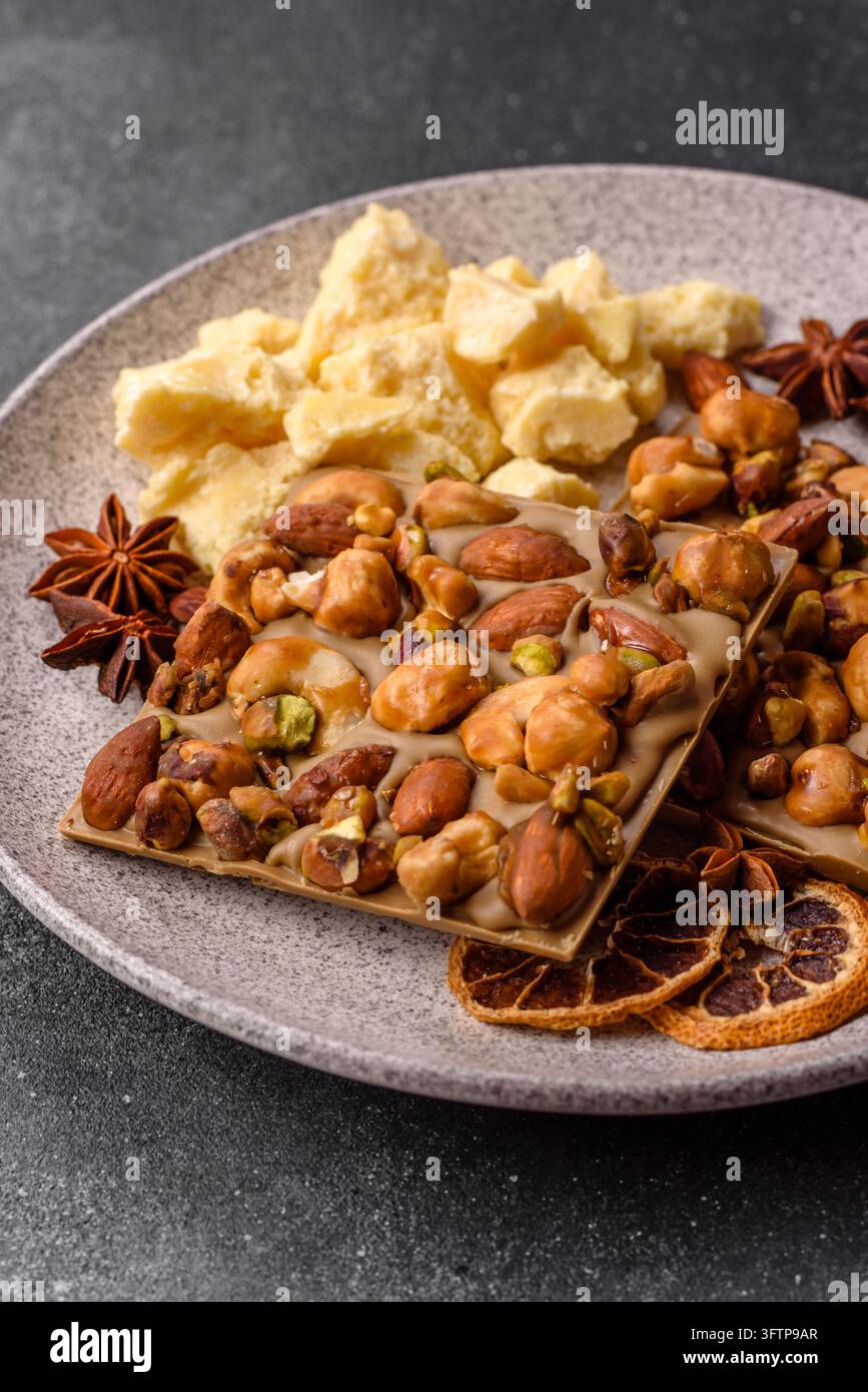 A bar of sugar free white chocolate with pistachios, almonds, and ...