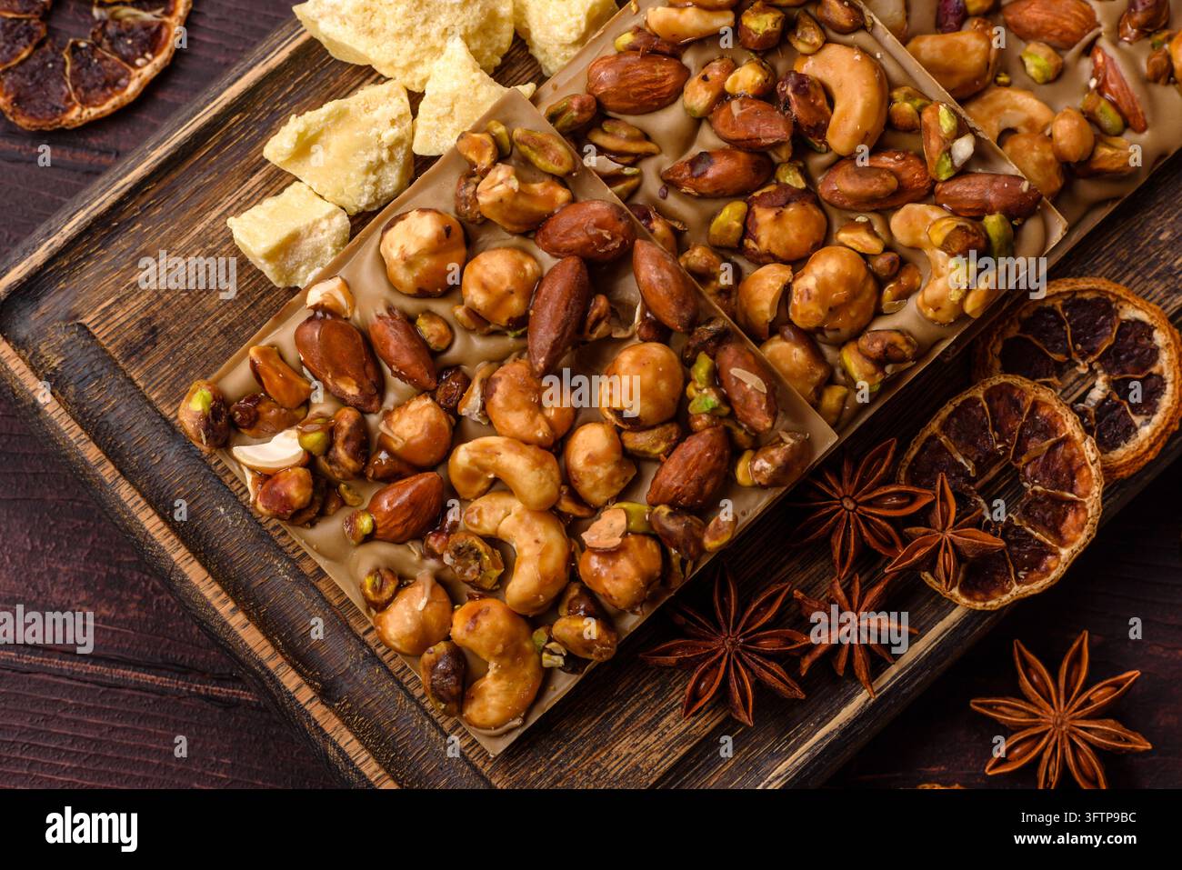 A bar of sugar free white chocolate with pistachios, almonds, and ...
