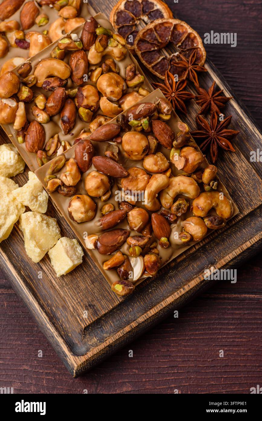 A bar of sugar free white chocolate with pistachios, almonds, and ...