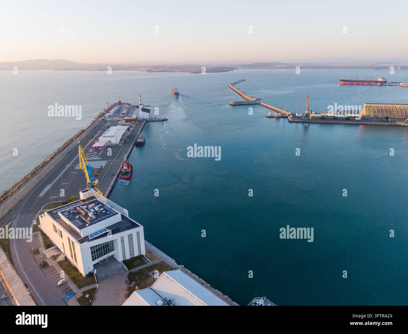 Aerial view of the Port of Burgas with a cargo ship entering the harbor ...