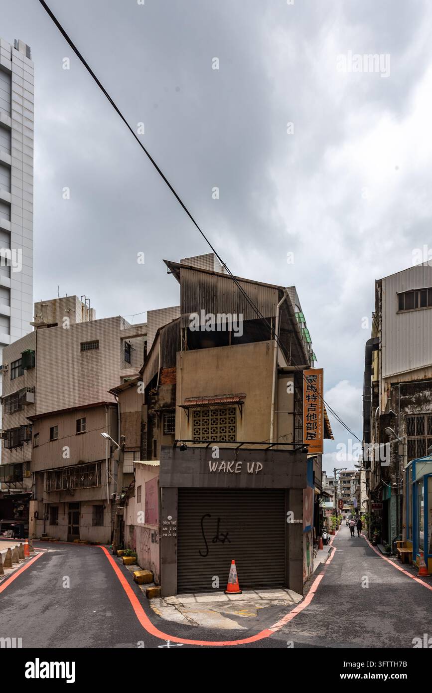 Tainan, Taiwan - 12 May 2015: View of a narrow street corner in Tainan ...