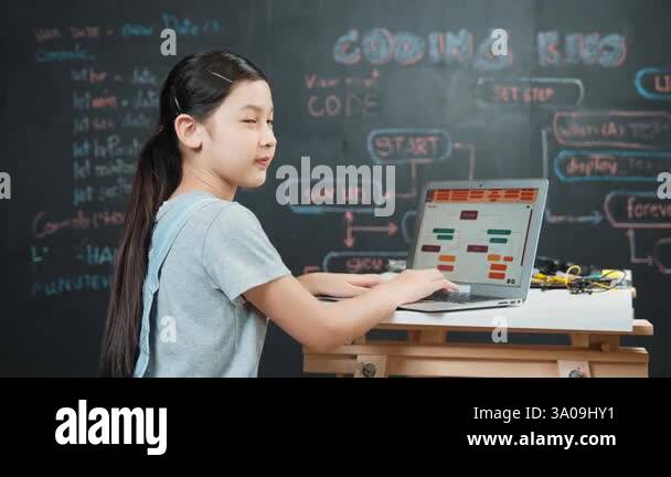 Asian student programming engineering code or prompt with equipment on ...