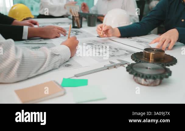 A vibrant scene of engineers working together to create mechanical designs. They analyze ...