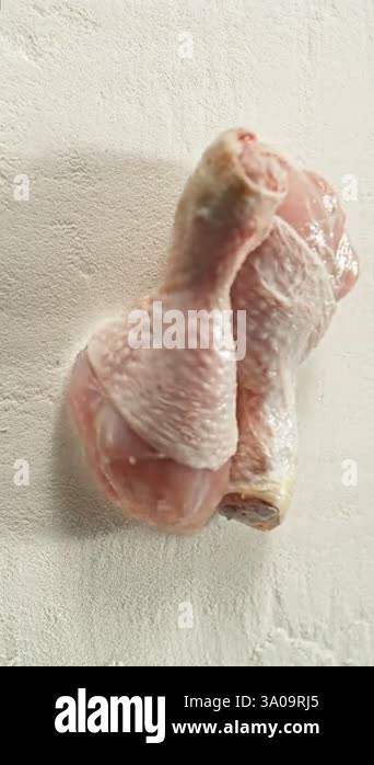 Super Slow Motion of Falling Raw Chicken Legs into Flour. Filmed on ...
