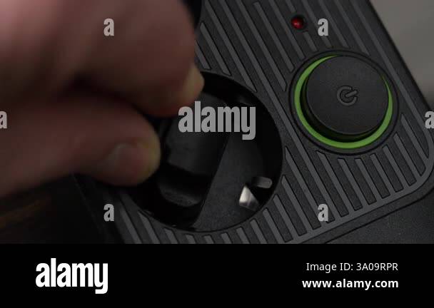 Put an electric plug into a socket. Turn off the electricity supply by ...