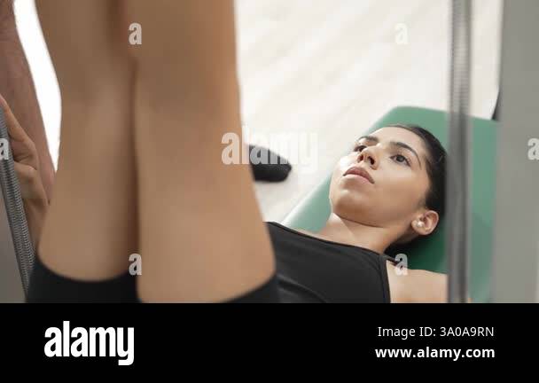 Close up of a client feet during a Pilates foot exercise using a ...
